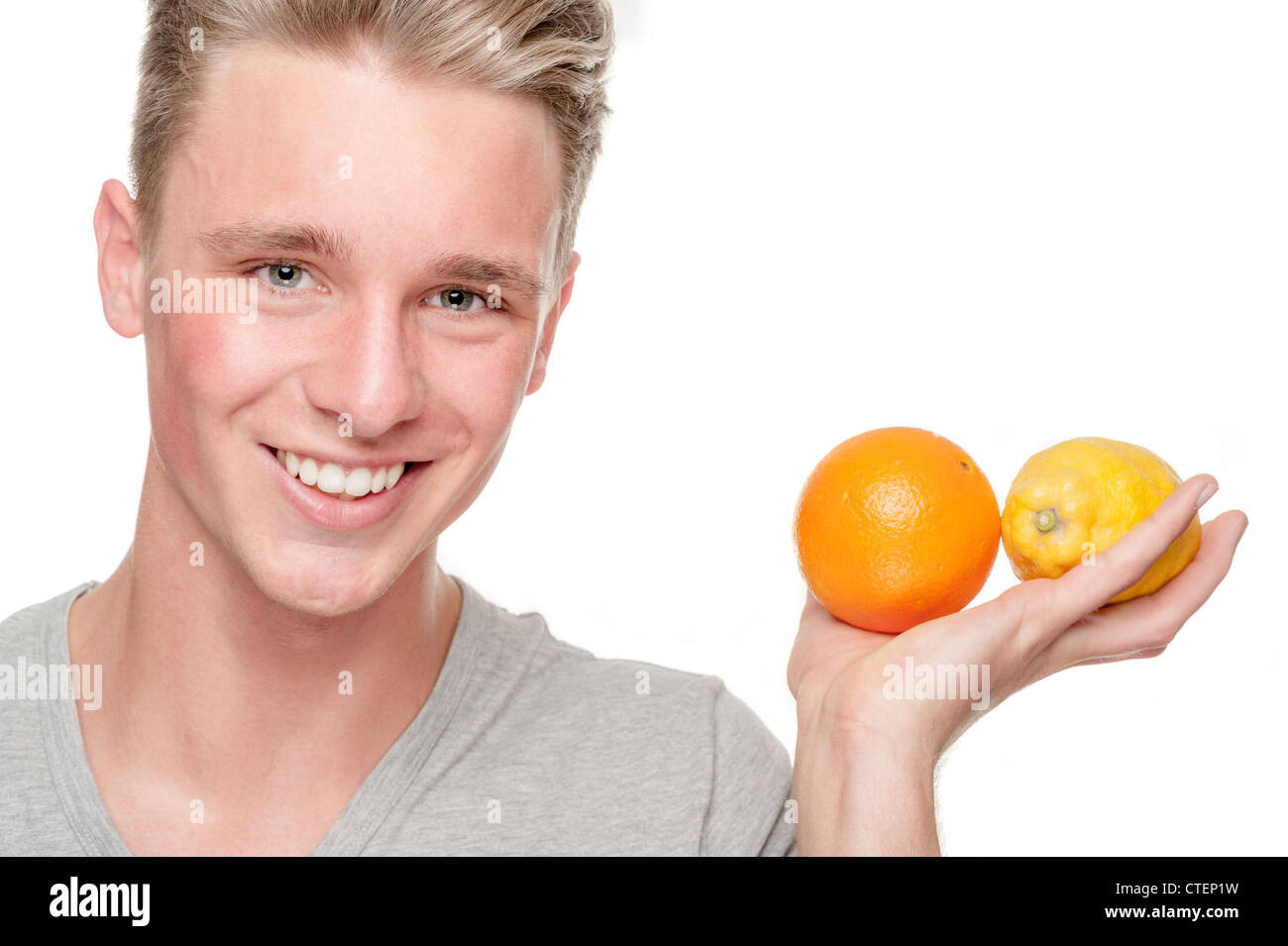 Full isolated studio picture from a happy young man with fruits Stock ...