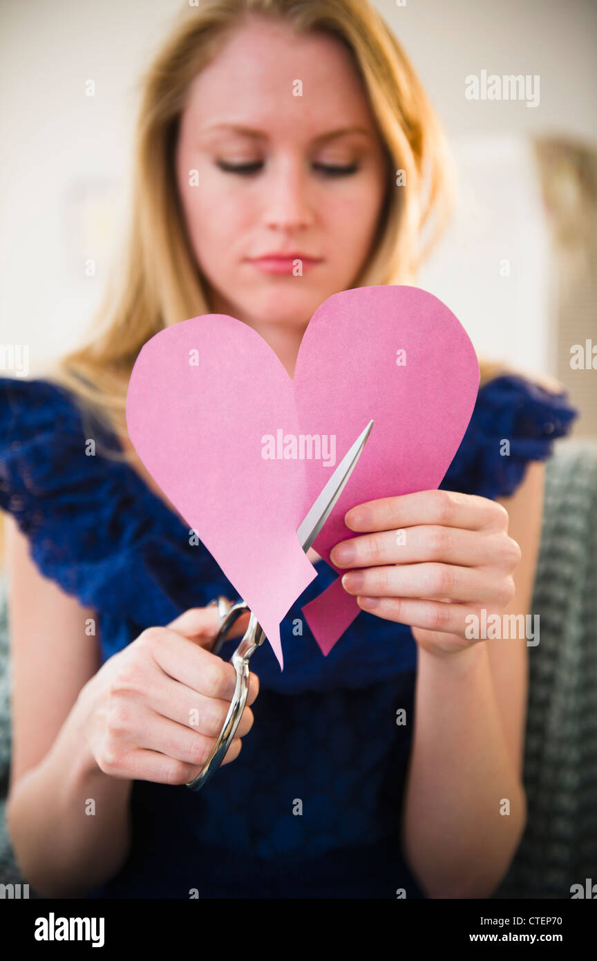 Cutting paper heart hi-res stock photography and images - Alamy