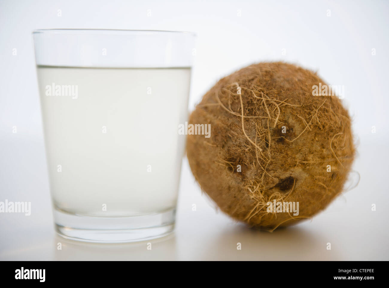 Coconut water in glass Stock Photo - Alamy