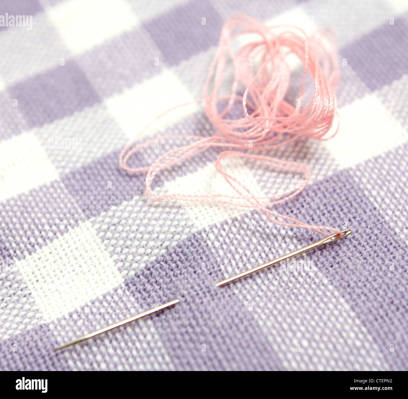 Needle and thread Stock Photo - Alamy