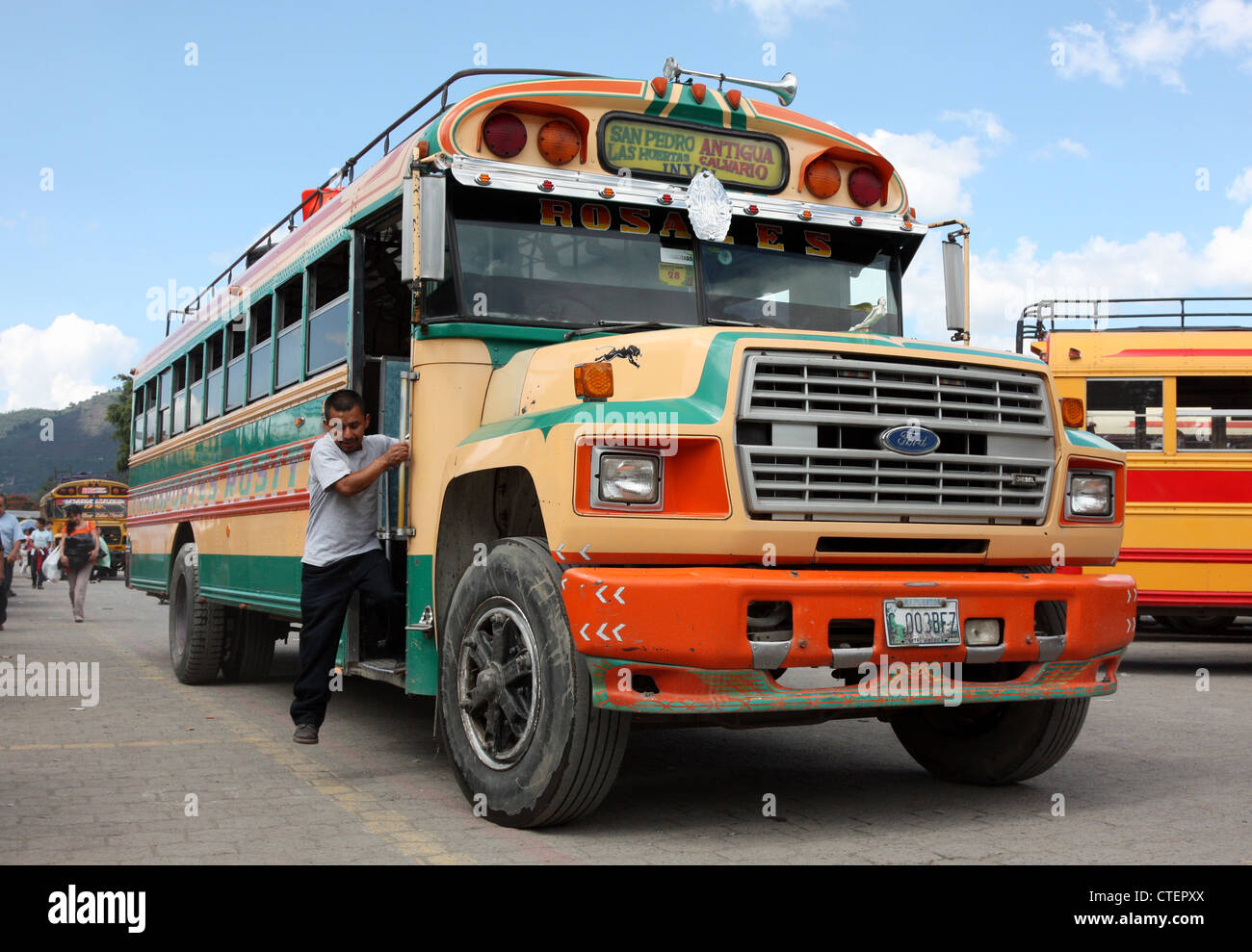 Brightly decorated local buses (chicken buses) at the bus station in ...