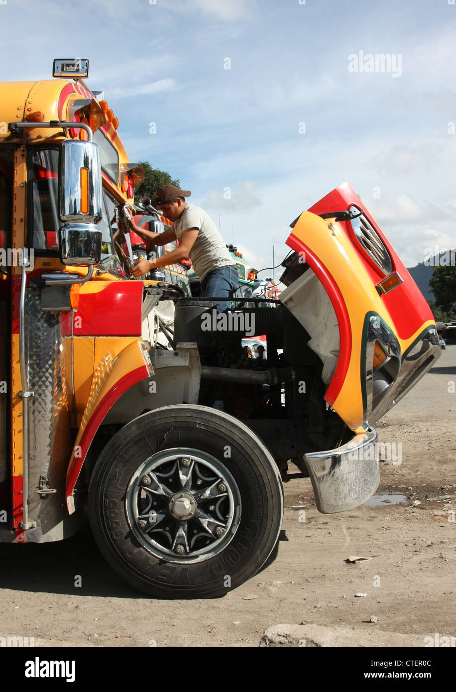 Brightly decorated local buses (chicken buses) at the bus station in ...
