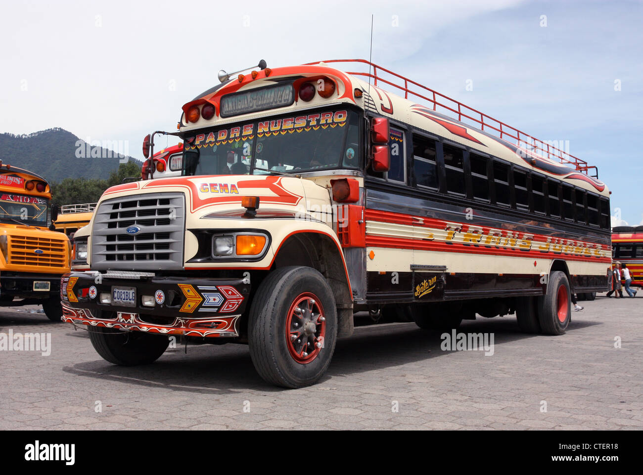 Brightly decorated local buses (chicken buses) at the bus station in ...