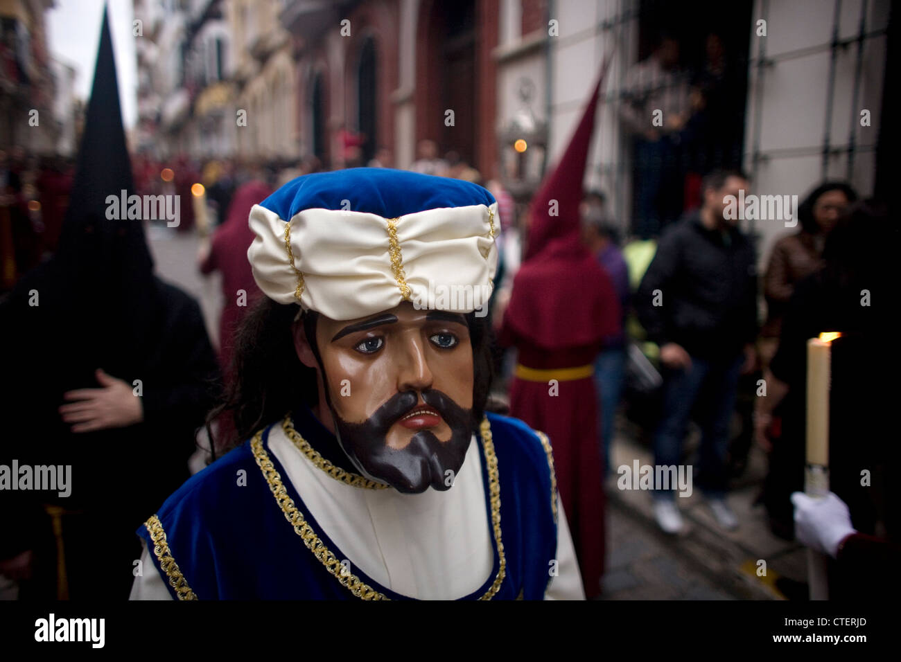 A man wearing a mask representing a biblical character during Easter ...