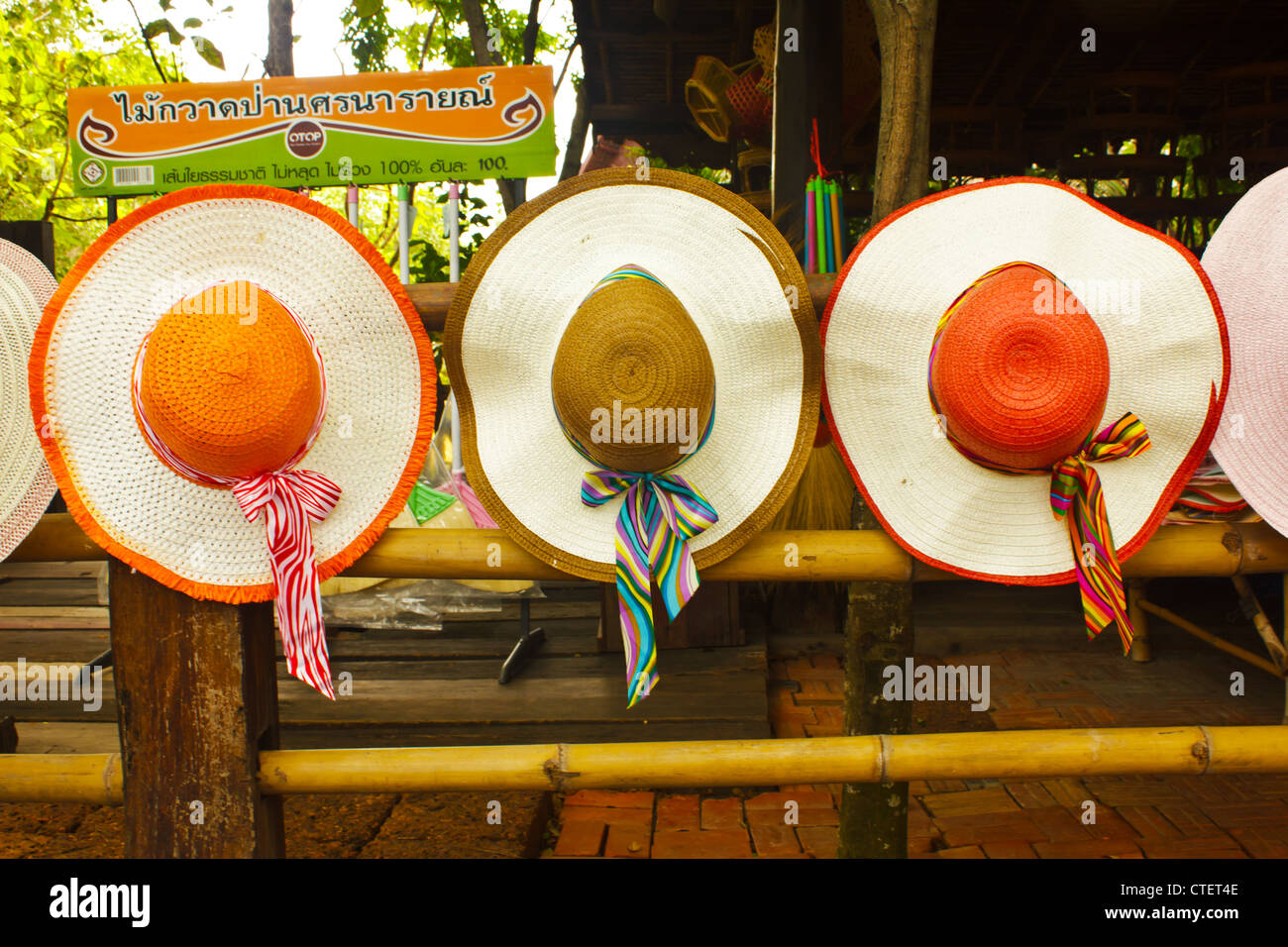 Stock Photo - Set of straw woven hats with colorful ribbons in a row ...