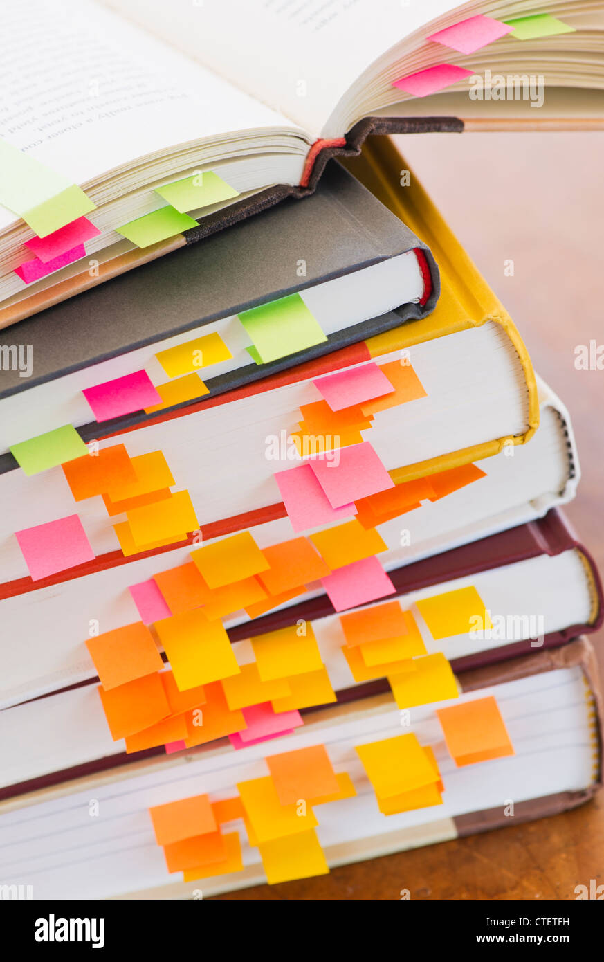 Close up adhesive notes in books, studio shot Stock Photo - Alamy