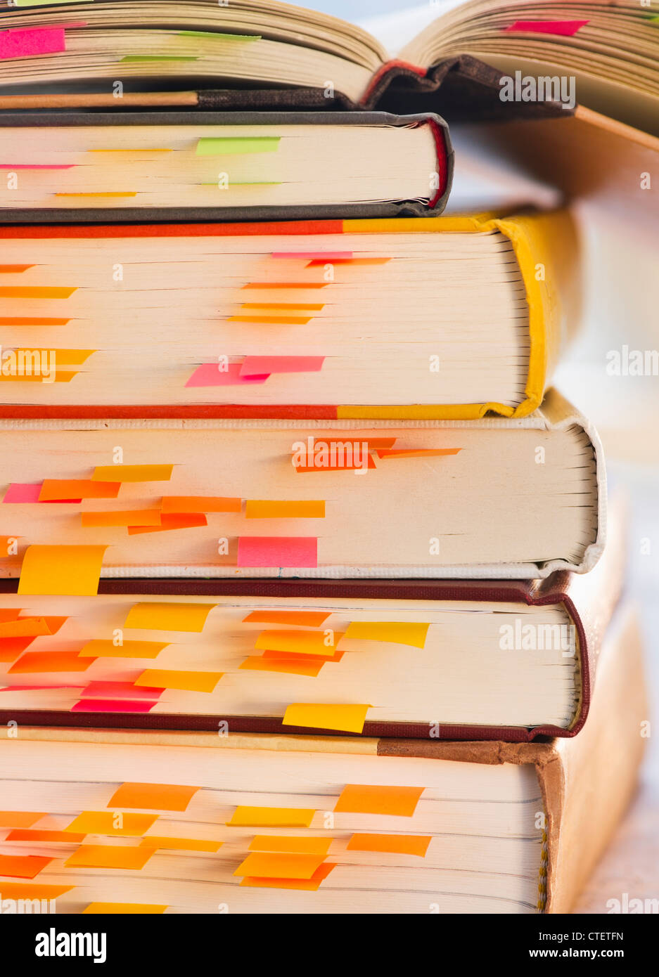 Close up adhesive notes in books, studio shot Stock Photo - Alamy