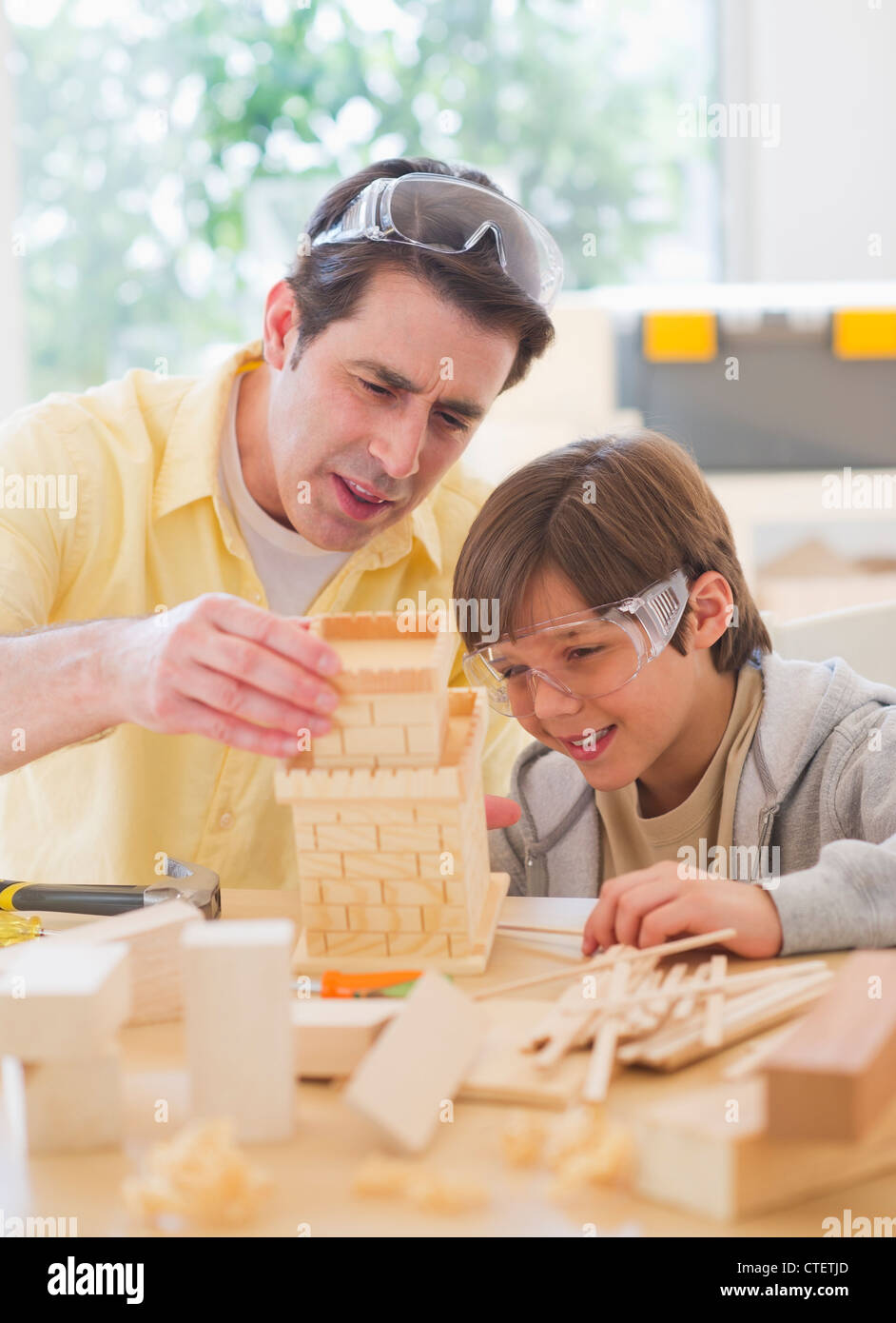 USA, New Jersey, Jersey City, Father constructing castle with son (10 ...