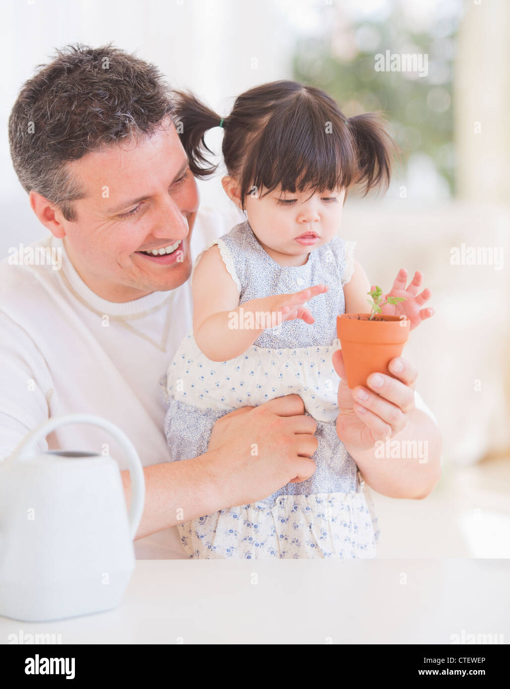 Baby sitting on pot hi-res stock photography and images - Alamy