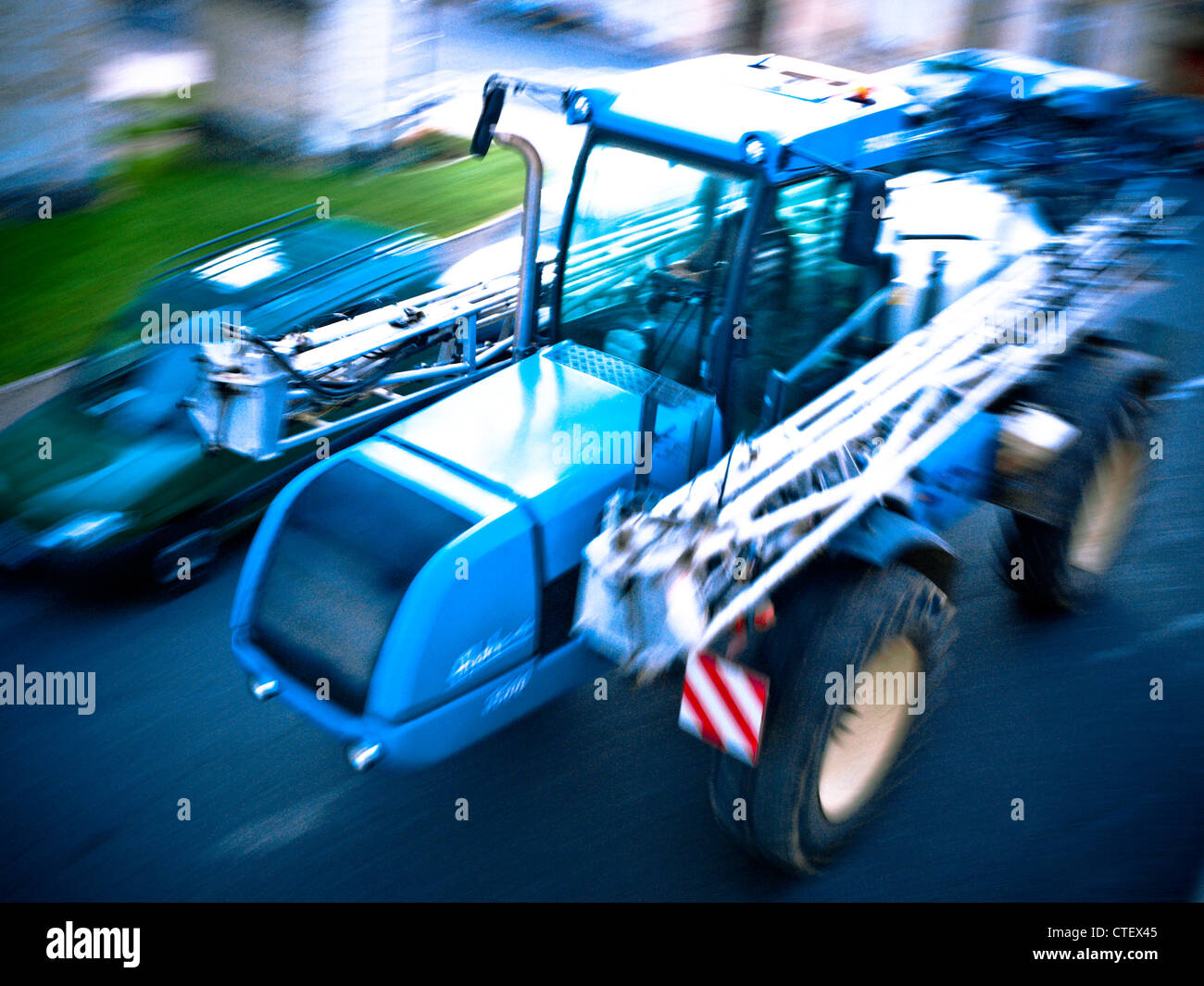Speeding agricultural spraying machine - France Stock Photo - Alamy