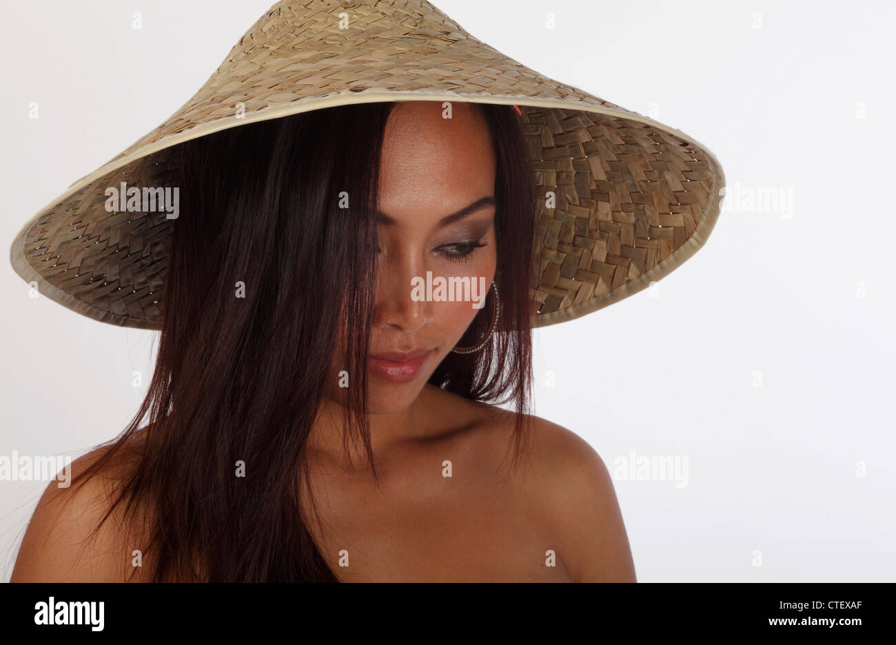 Oriental woman in a coolie hat Stock Photo - Alamy