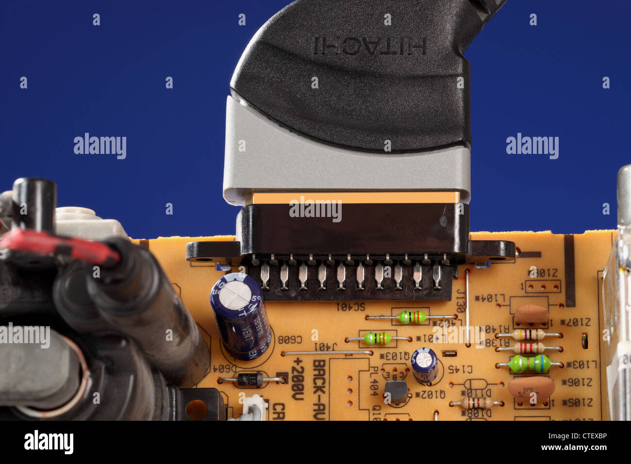 A gold plated scart lead plugged into a television circuit board Stock ...