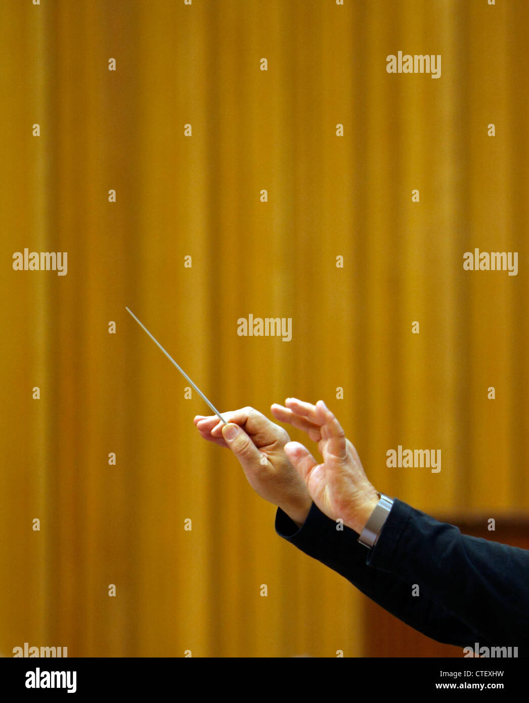 generic image of a conductors hands in a rehearsal Stock Photo - Alamy