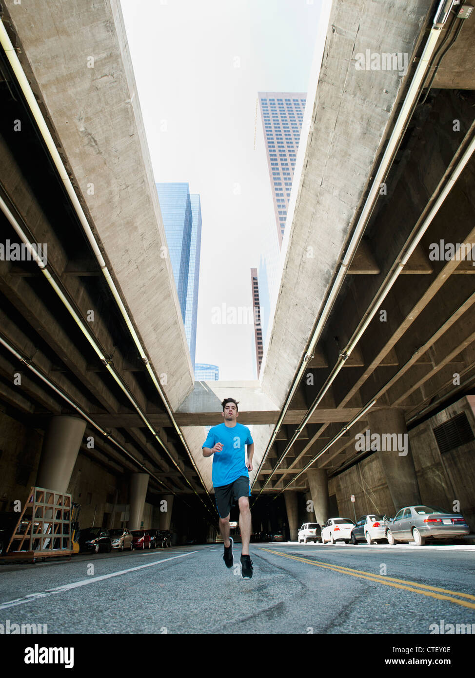 USA, California, Los Angeles, Young man running on city street Stock ...