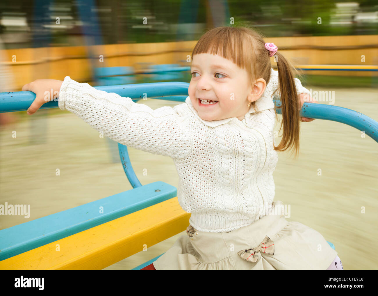 Merry go round spin playground hi-res stock photography and images - Alamy