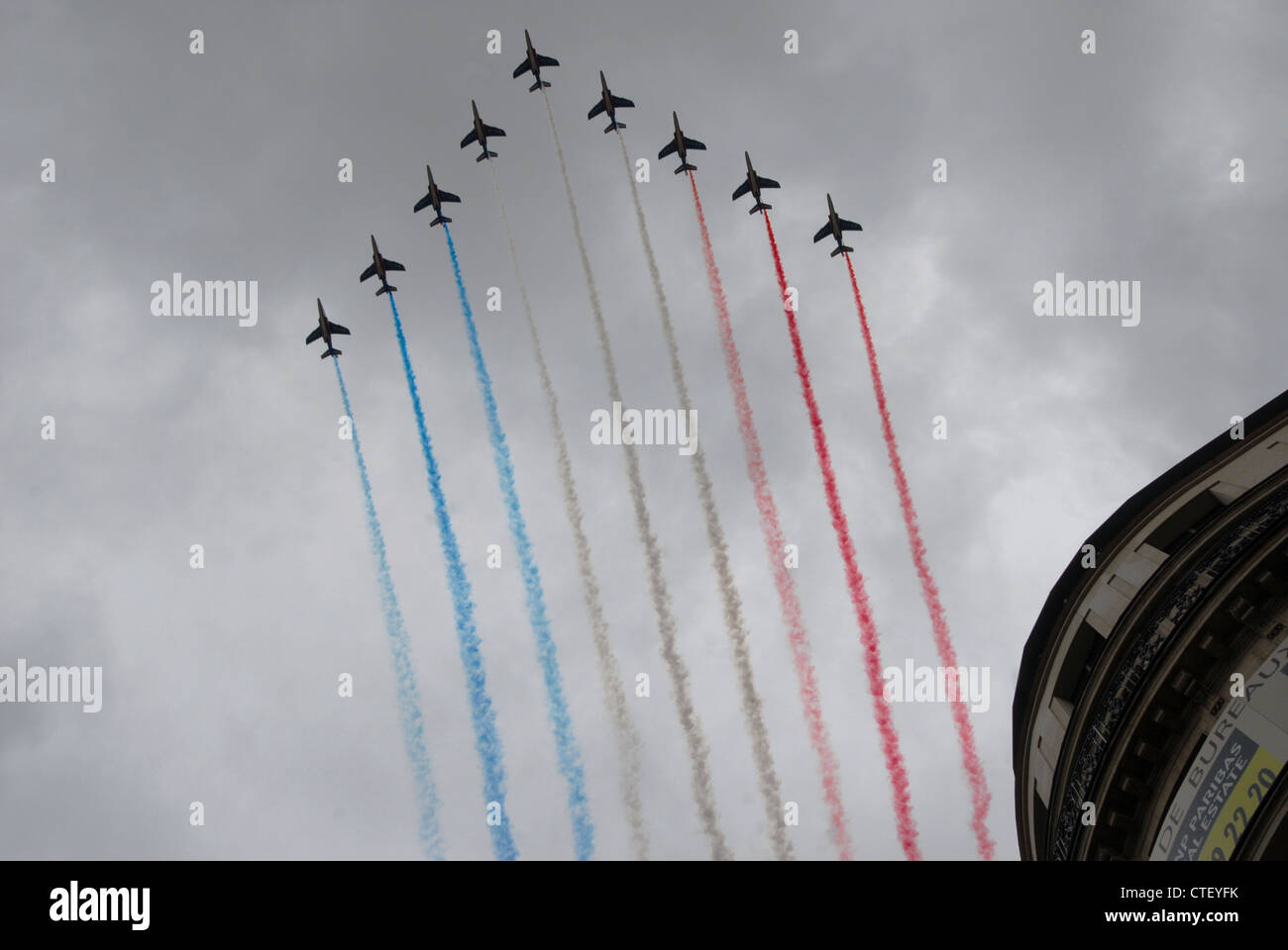 Bastille Day in Paris France. French air force jets fly in formation ...