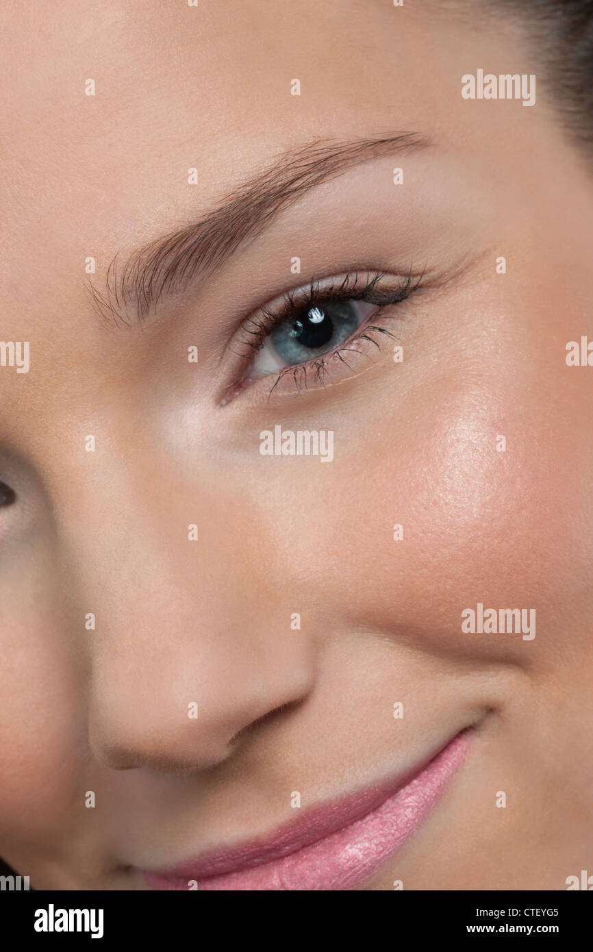 Close-up of smiling female face Stock Photo - Alamy