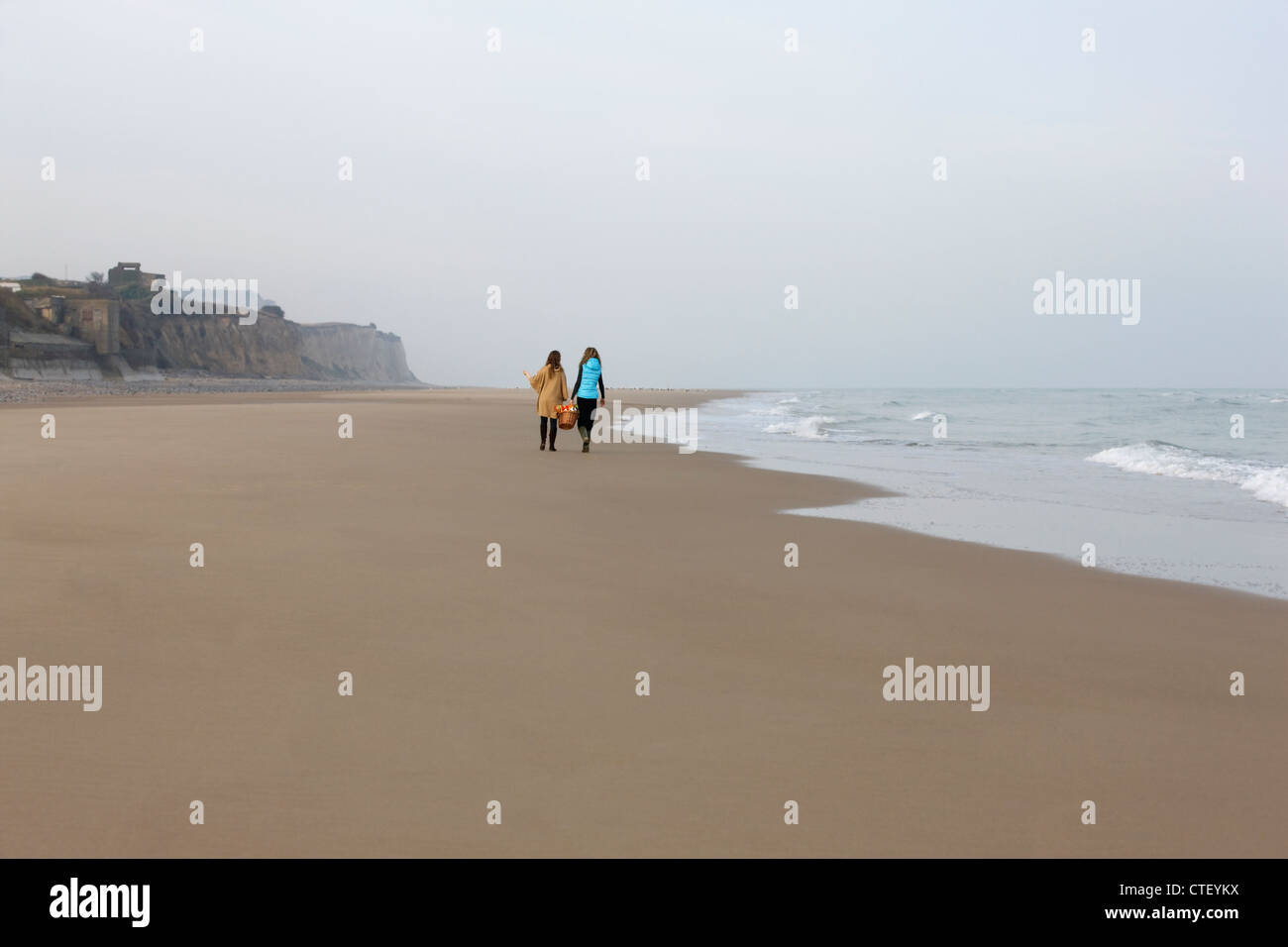France, Pas-de-Calais, Escalles, Two women strolling on empty beach ...