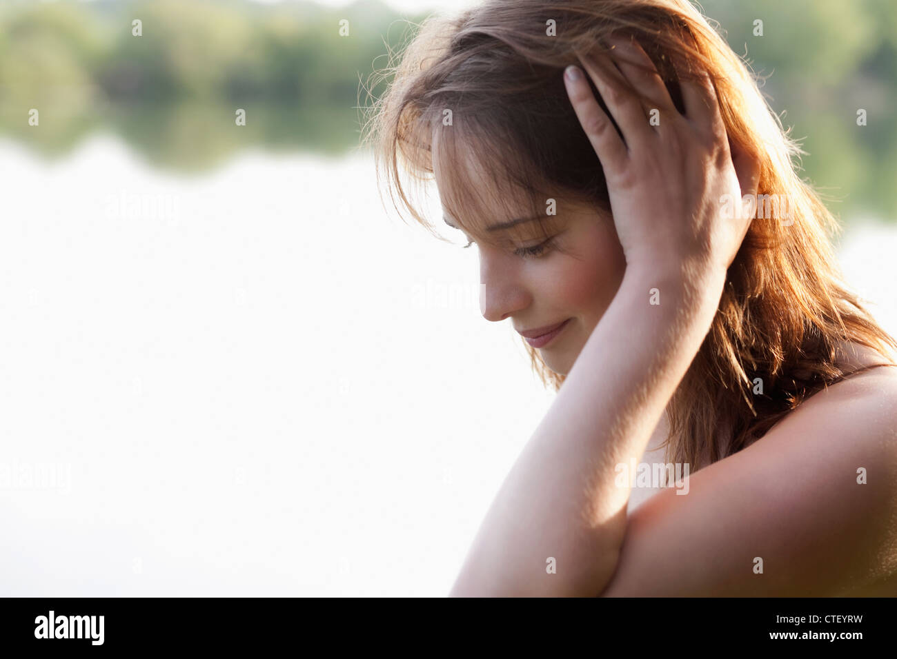 France, Picardie, Albert, Young woman running head through hair Stock ...