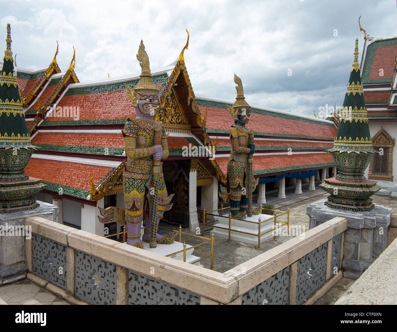 Grand Palace in Bangkok Thailand with large ornate guard statues Stock ...