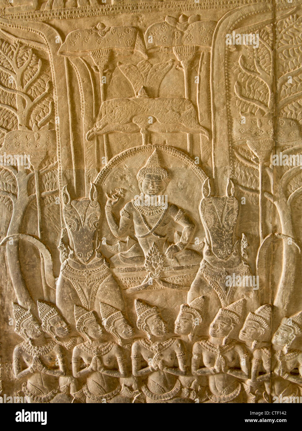 Detailed carving on wall of Angkor wat temple in Cambodia on cloudy day ...