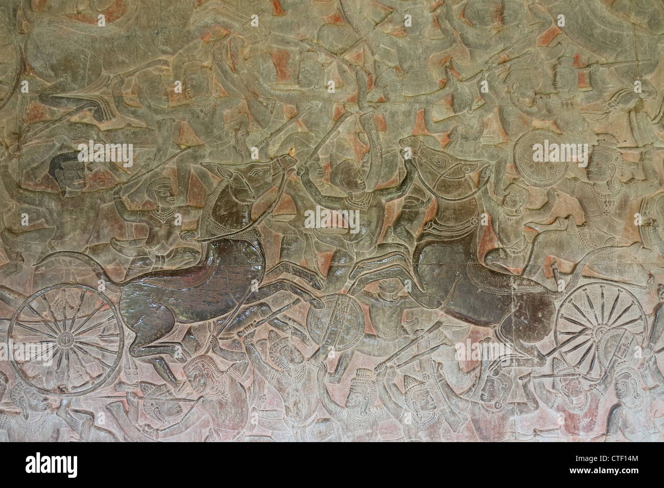 Detailed carving on wall of Angkor wat temple in Cambodia on cloudy day ...