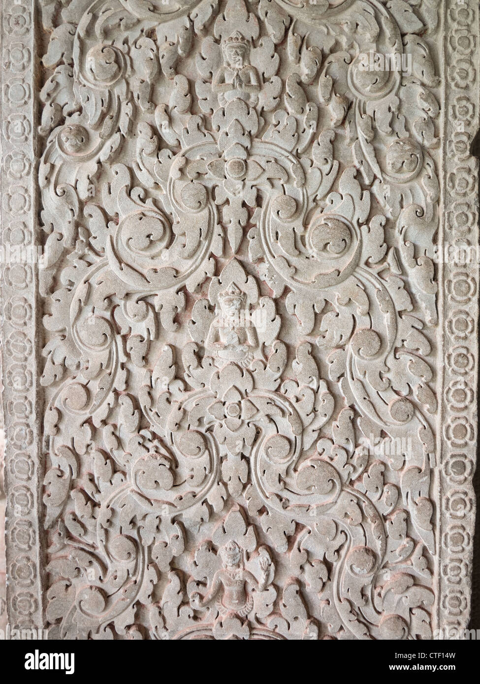 Detailed carving on wall of Angkor wat temple in Cambodia on cloudy day ...