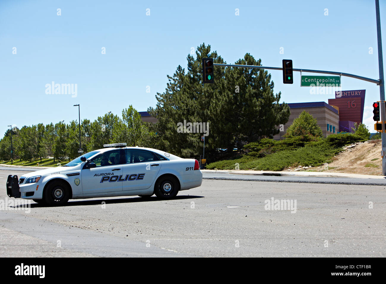 A police vehicle guards the outside perimeter of the deadly movie ...