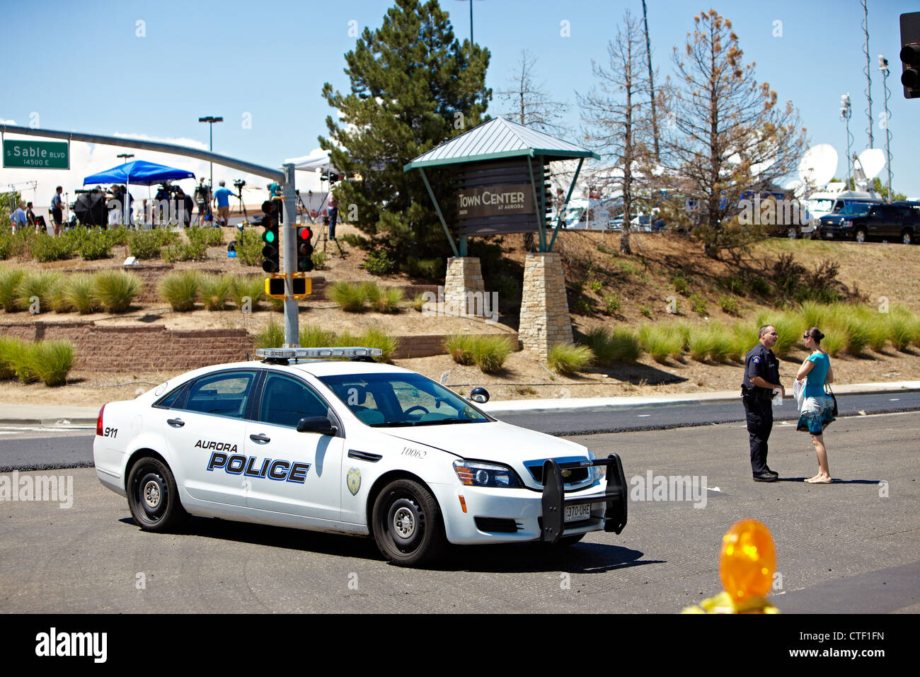 A police vehicle guards the outside perimeter of the deadly movie ...