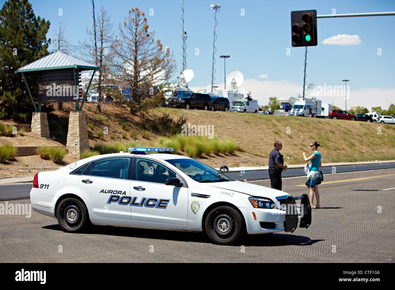 A police vehicle guards the outside perimeter of the deadly movie ...