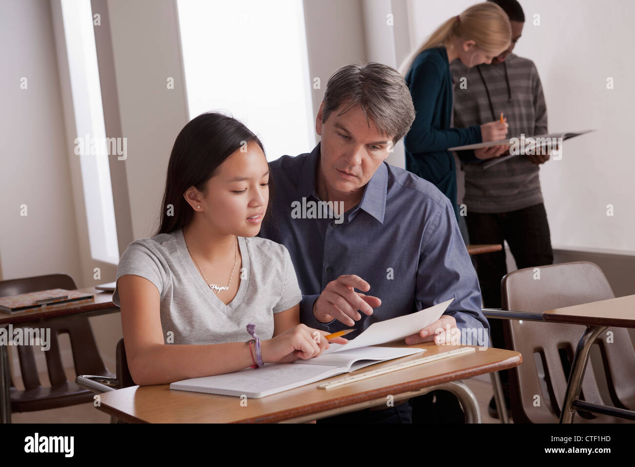 USA, California, Los Angeles, Teacher with teenage students (14-15) at ...