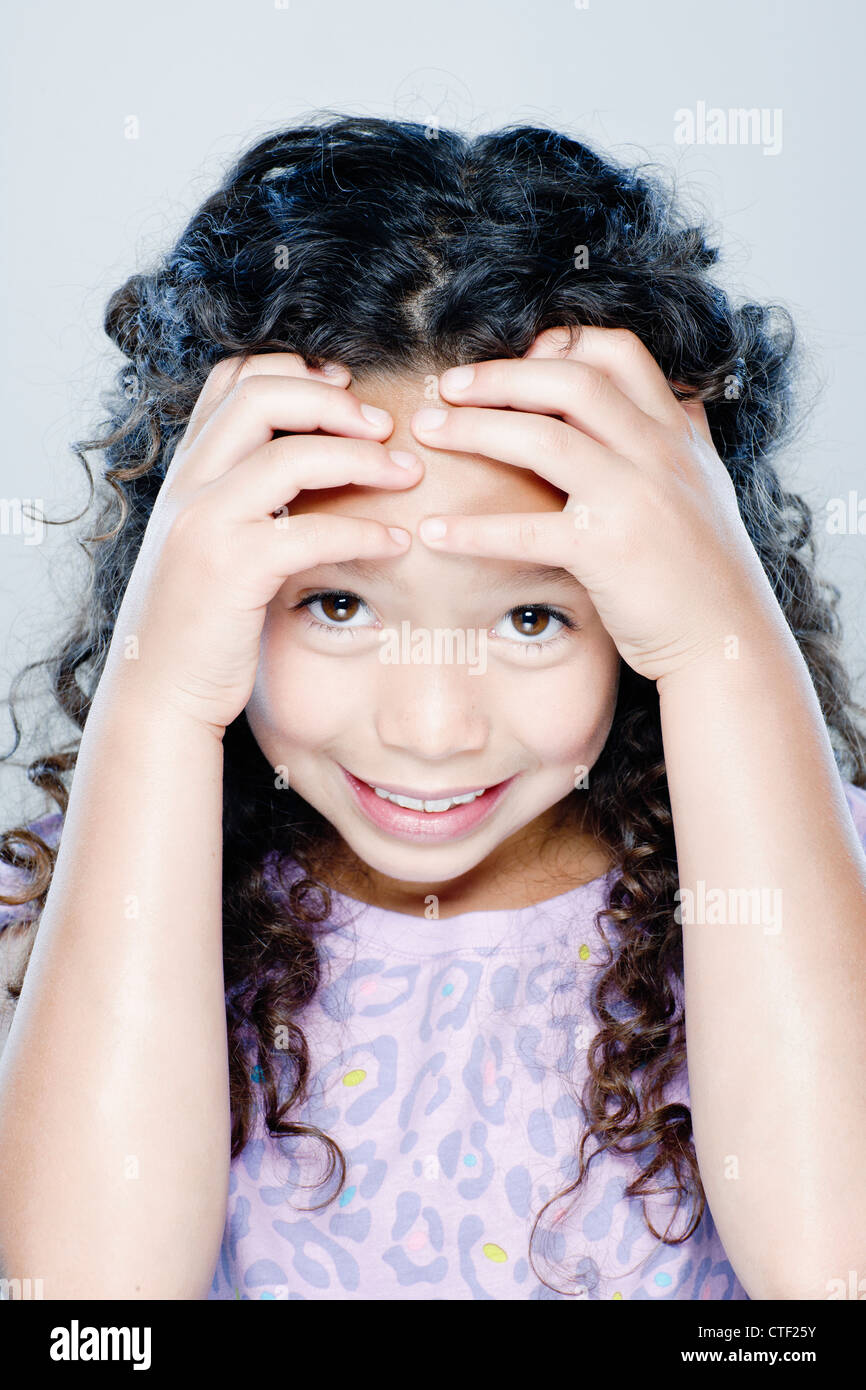 Portrait of smiling girl (8-9), studio shot Stock Photo - Alamy