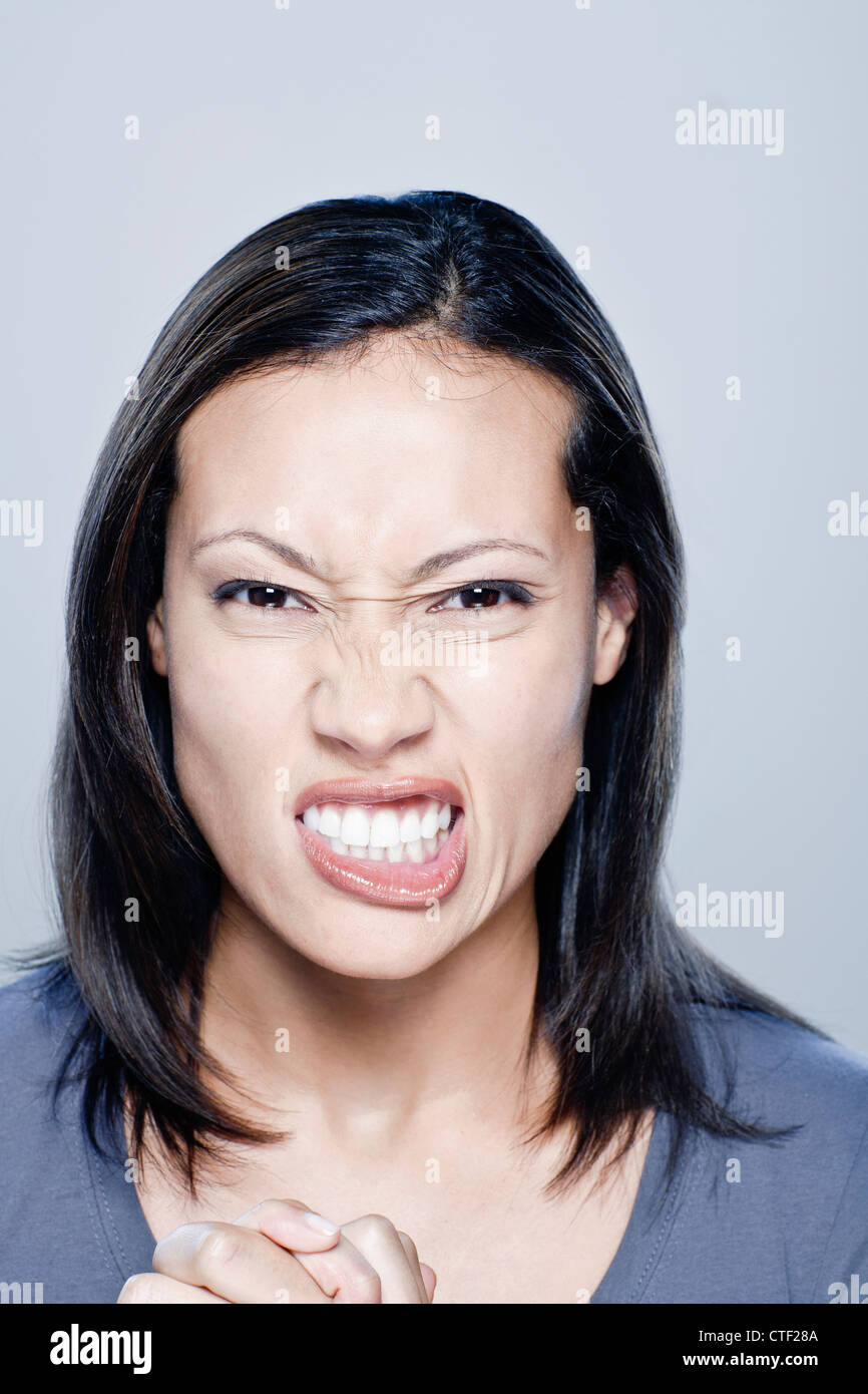 Portrait of angry young woman, studio shot Stock Photo - Alamy