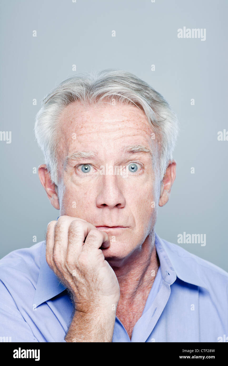 Portrait of worried senior man, studio shot Stock Photo - Alamy