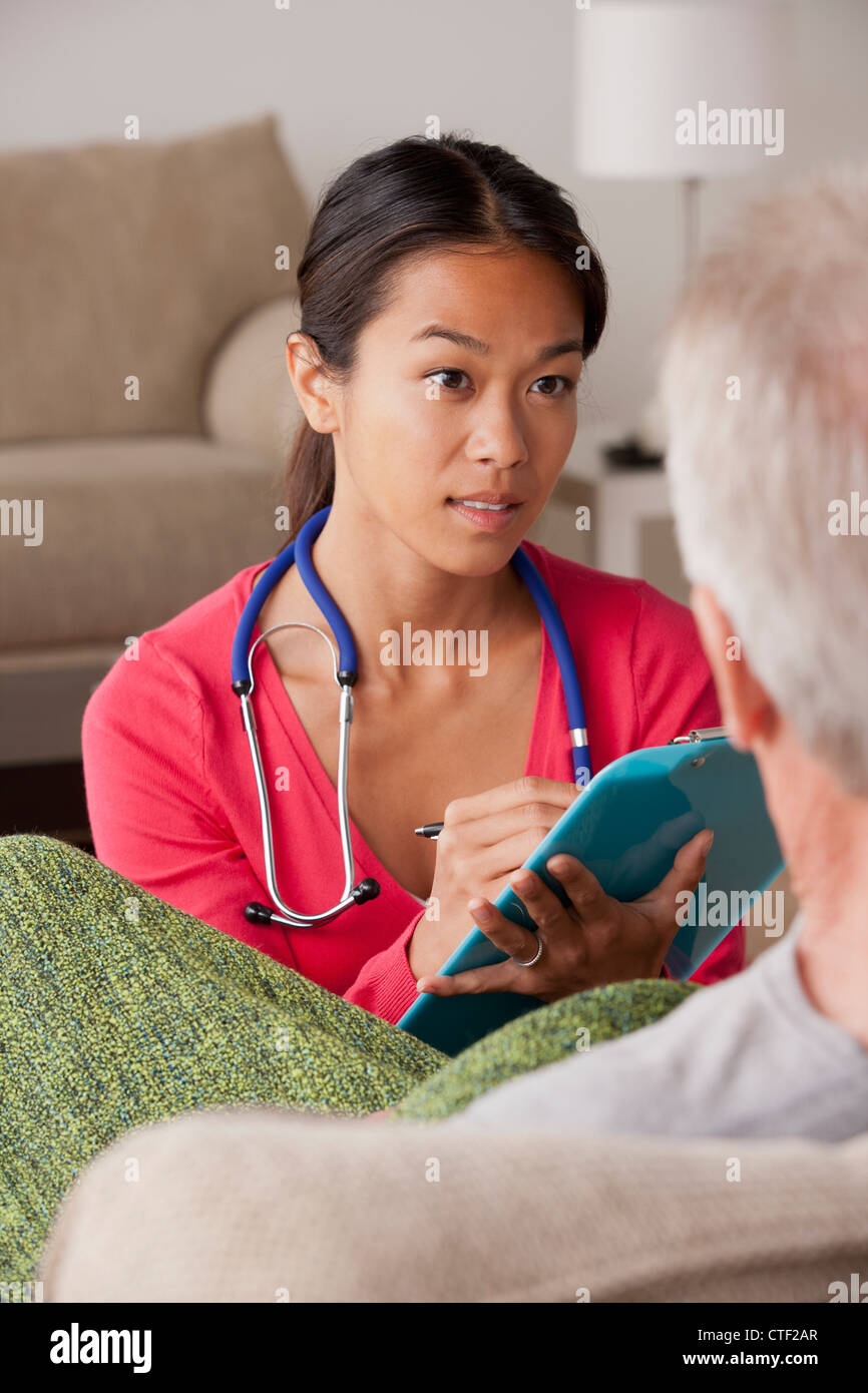 USA, California, Los Angeles, Female nurse with senior patient at home ...