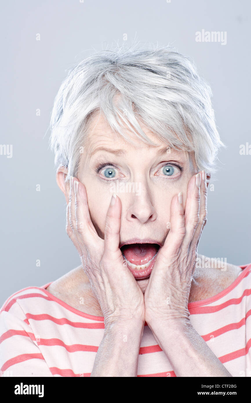 Portrait of shocked senior woman, studio shot Stock Photo - Alamy