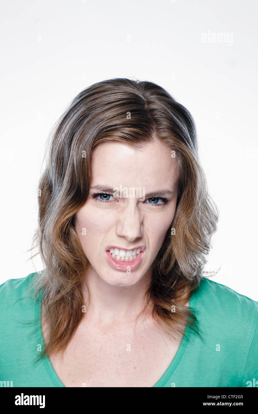 Portrait of angry young woman, studio shot Stock Photo - Alamy