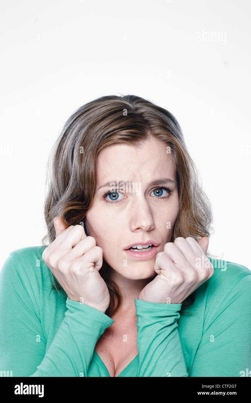 Portrait of worried young woman, studio shot Stock Photo - Alamy