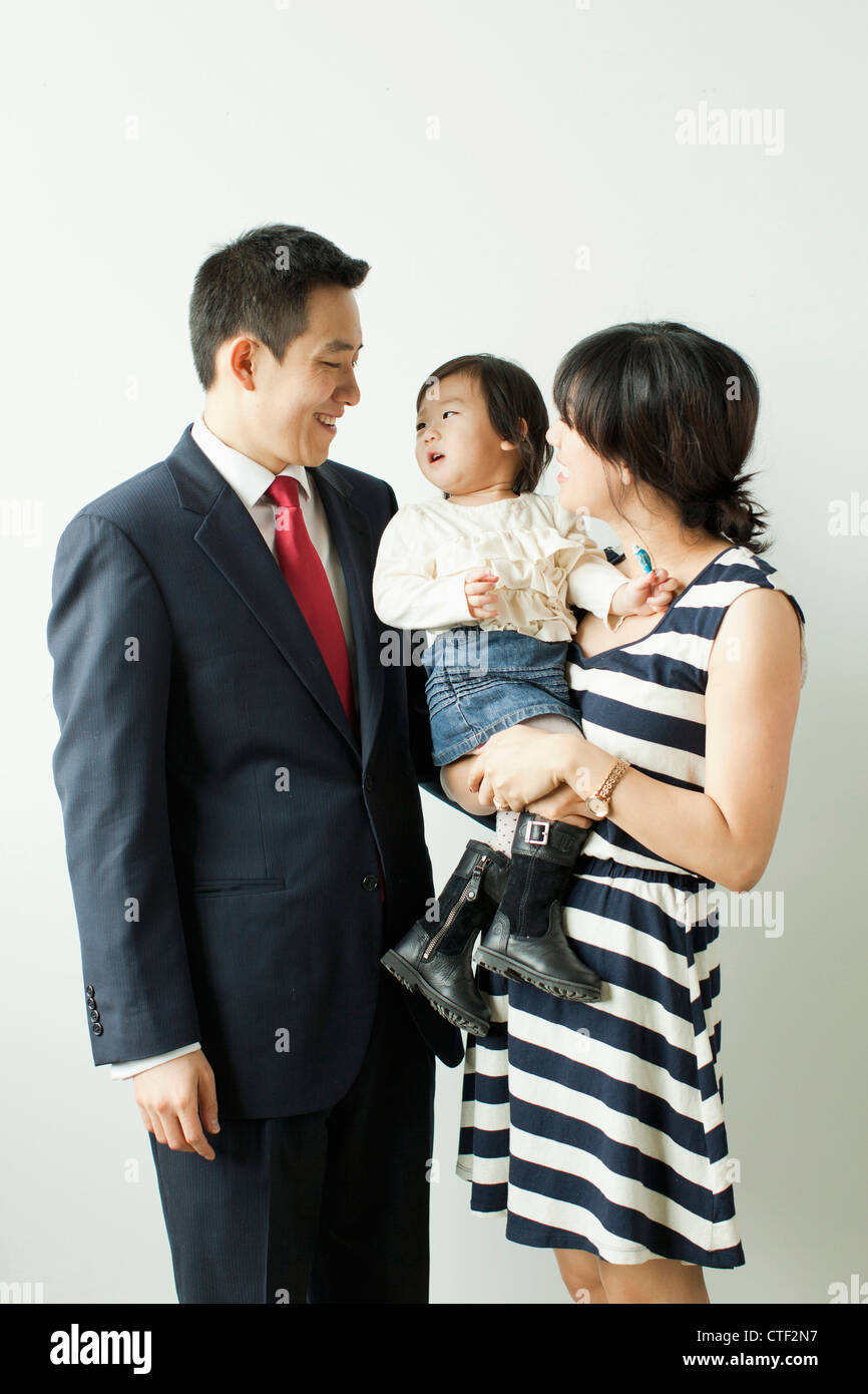 USA, Utah, Salt Lake City, Portrait of young parents with baby girl (12 ...