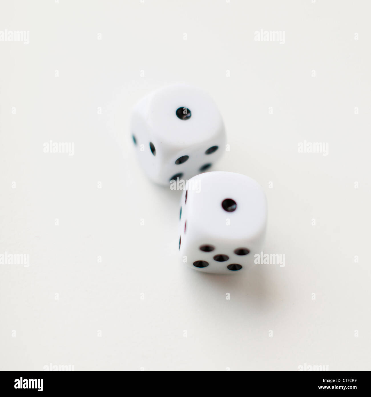 Dices on white background, studio shot Stock Photo - Alamy