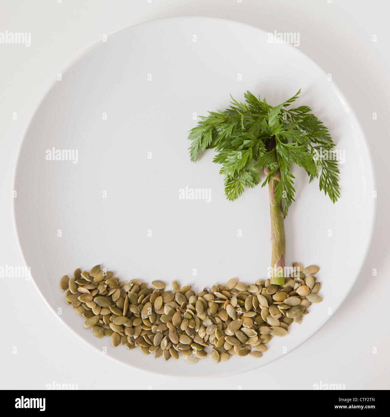 Palm tree on plate made out of food, studio shot Stock Photo - Alamy
