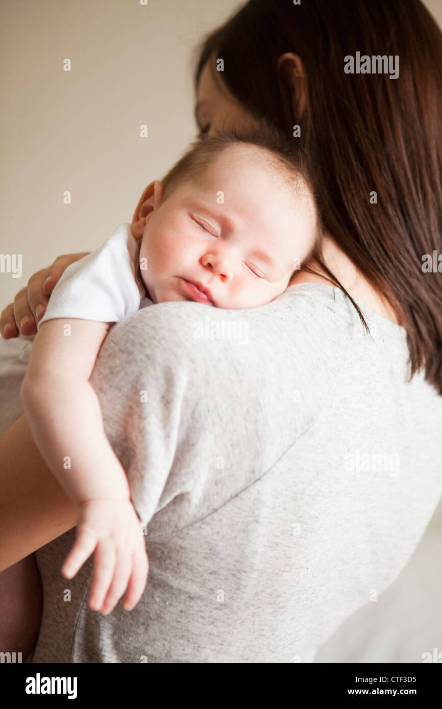 Mother embracing baby girl (2-5 months Stock Photo - Alamy