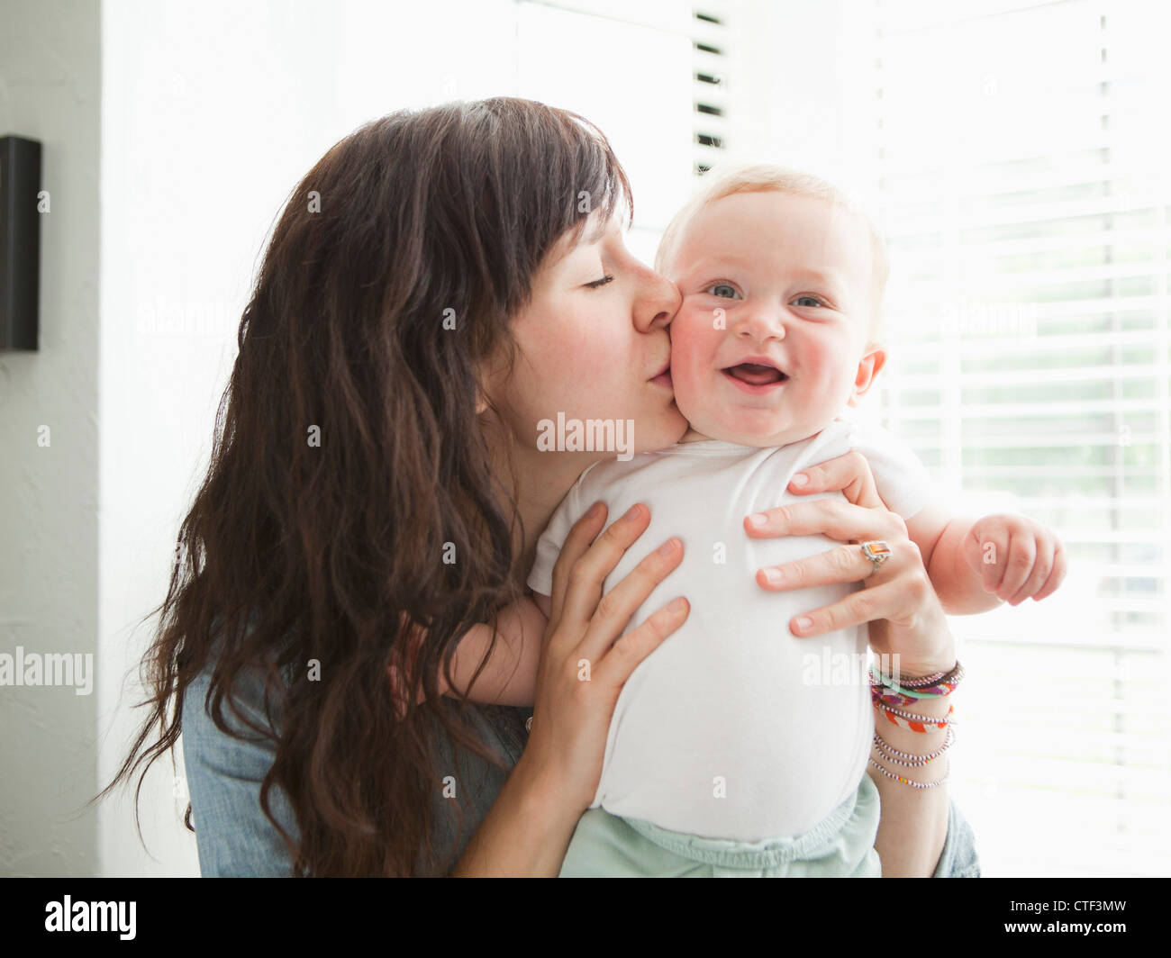 Mother kissing baby boy 6 11 hi-res stock photography and images - Alamy