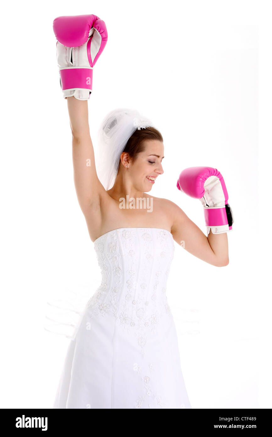 Woman in a wedding dress with boxing gloves Stock Photo - Alamy