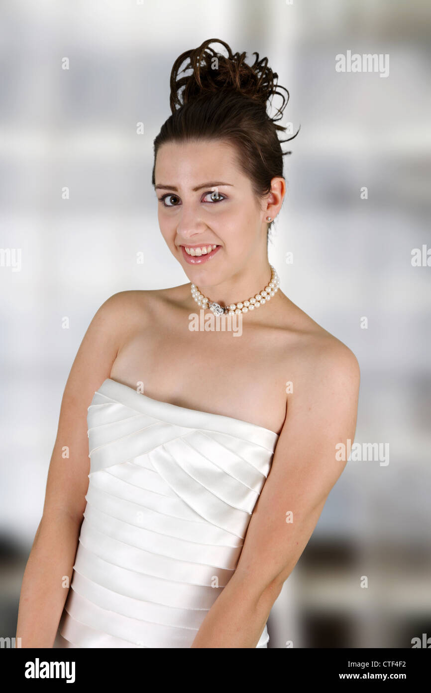 Woman in a wedding dress getting ready Stock Photo - Alamy