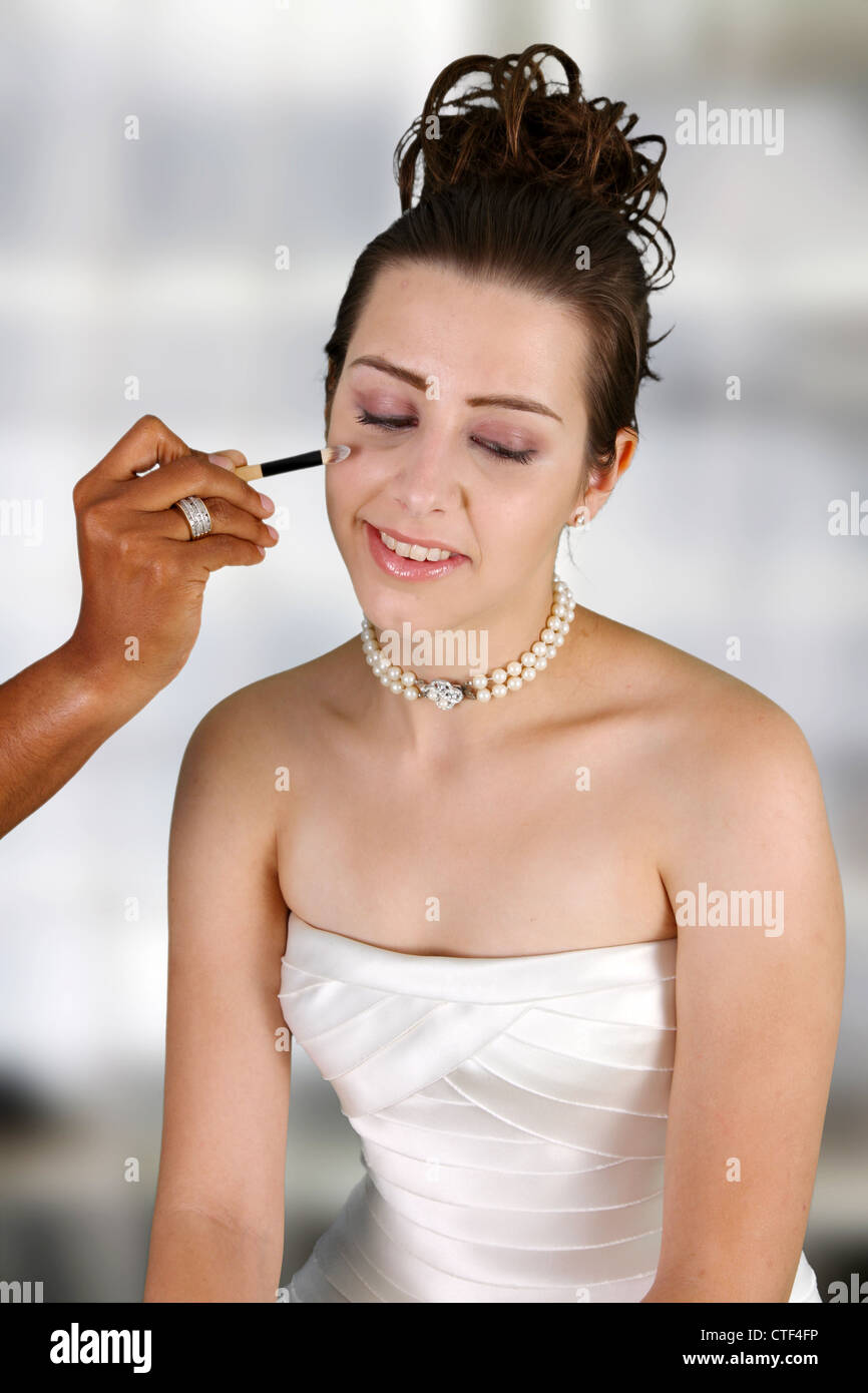 Woman in a wedding dress getting ready Stock Photo - Alamy
