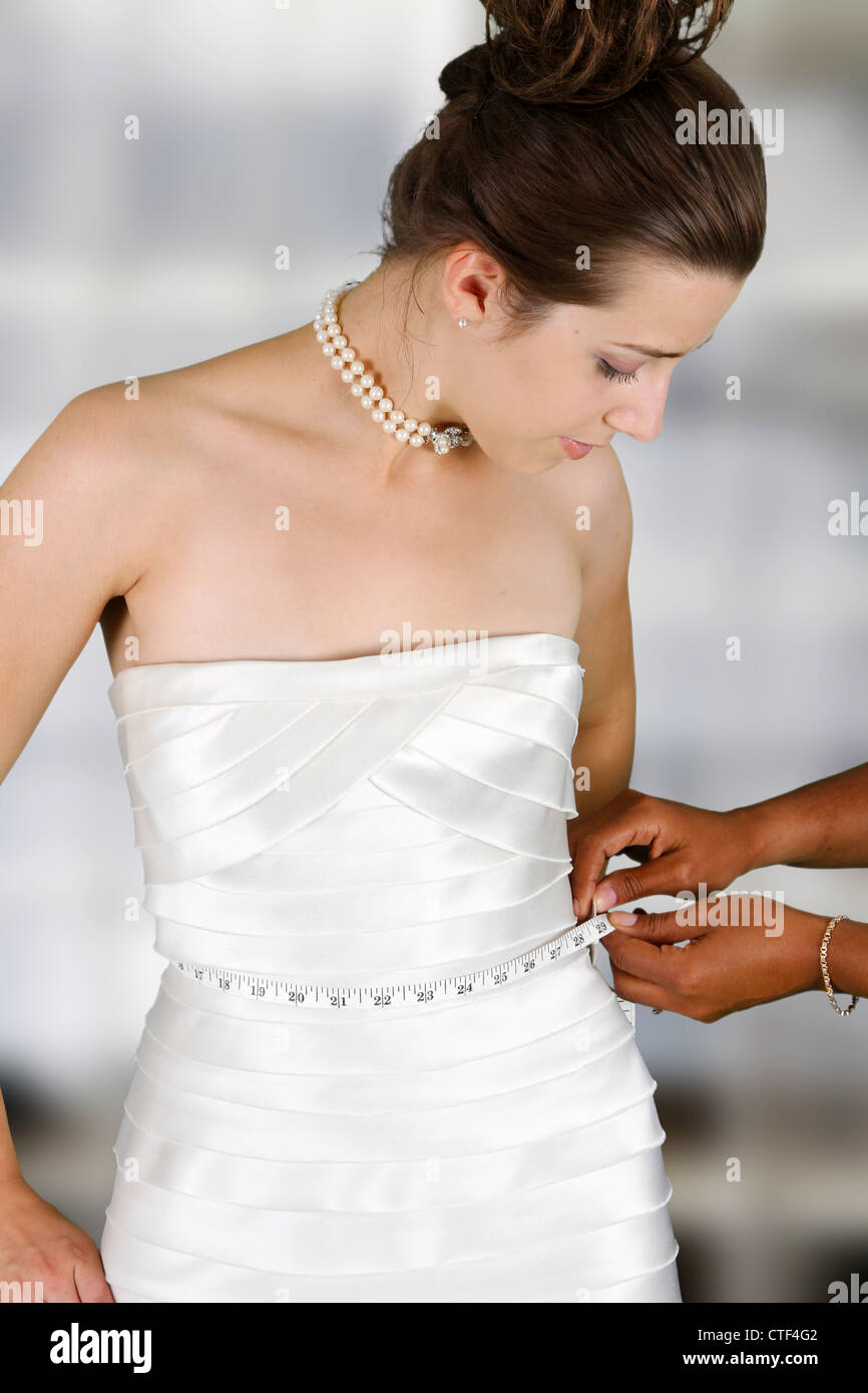 Woman in a wedding dress getting ready for the day Stock Photo - Alamy
