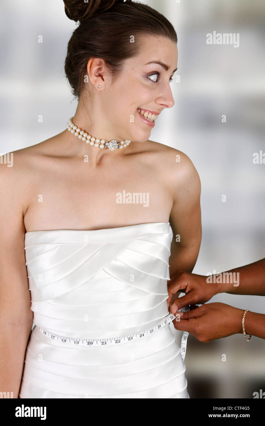 Woman in a wedding dress getting ready for the day Stock Photo - Alamy