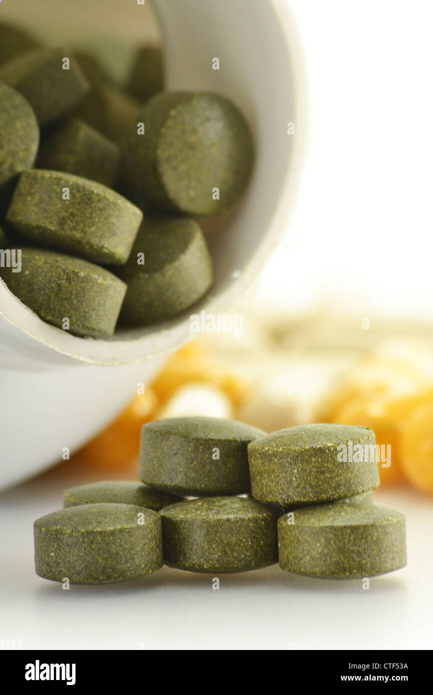 Composition with dietary supplement capsules and containers. Variety of ...