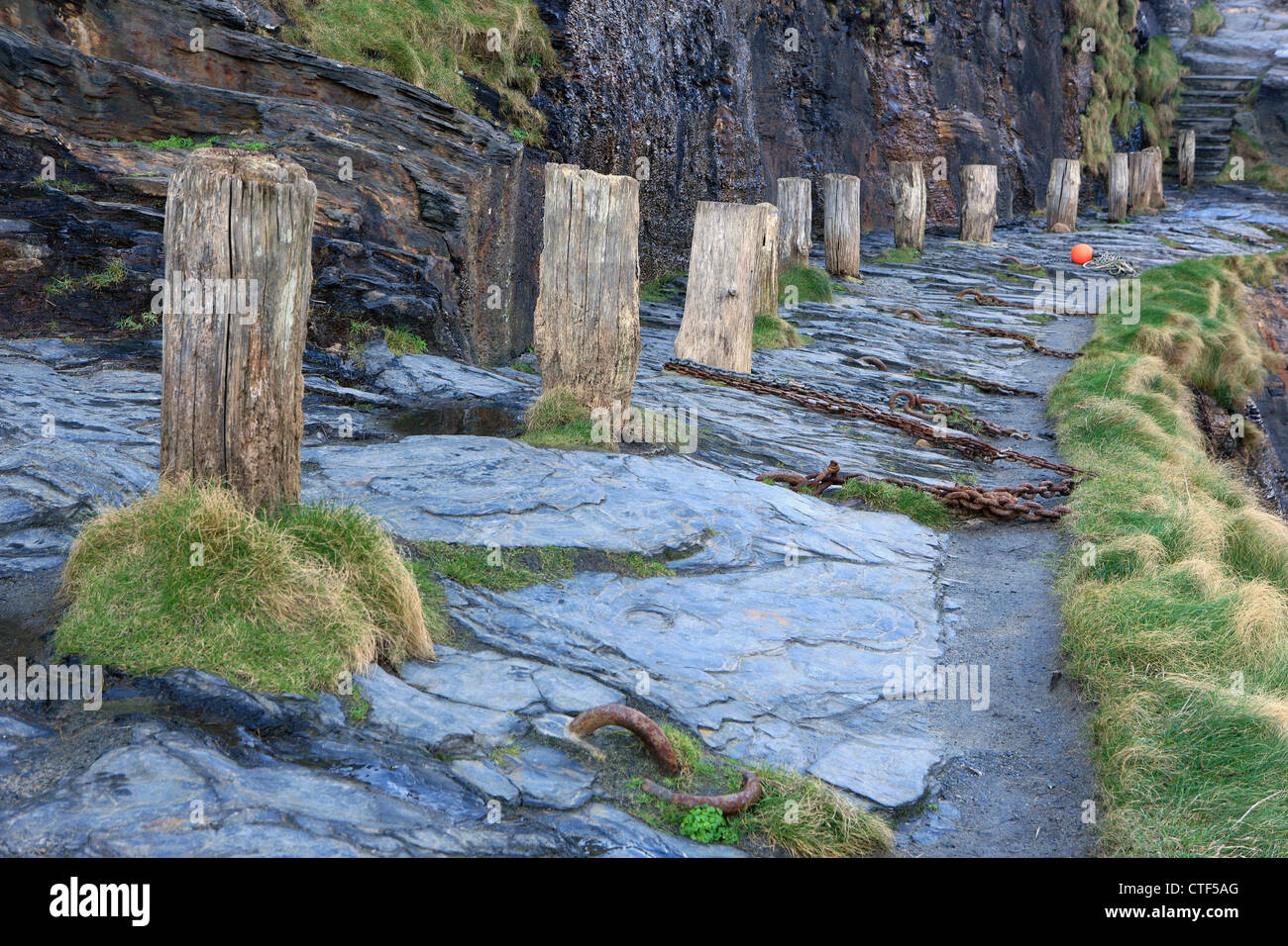 A row of bollards on the quayside around the harbour in the fishing ...